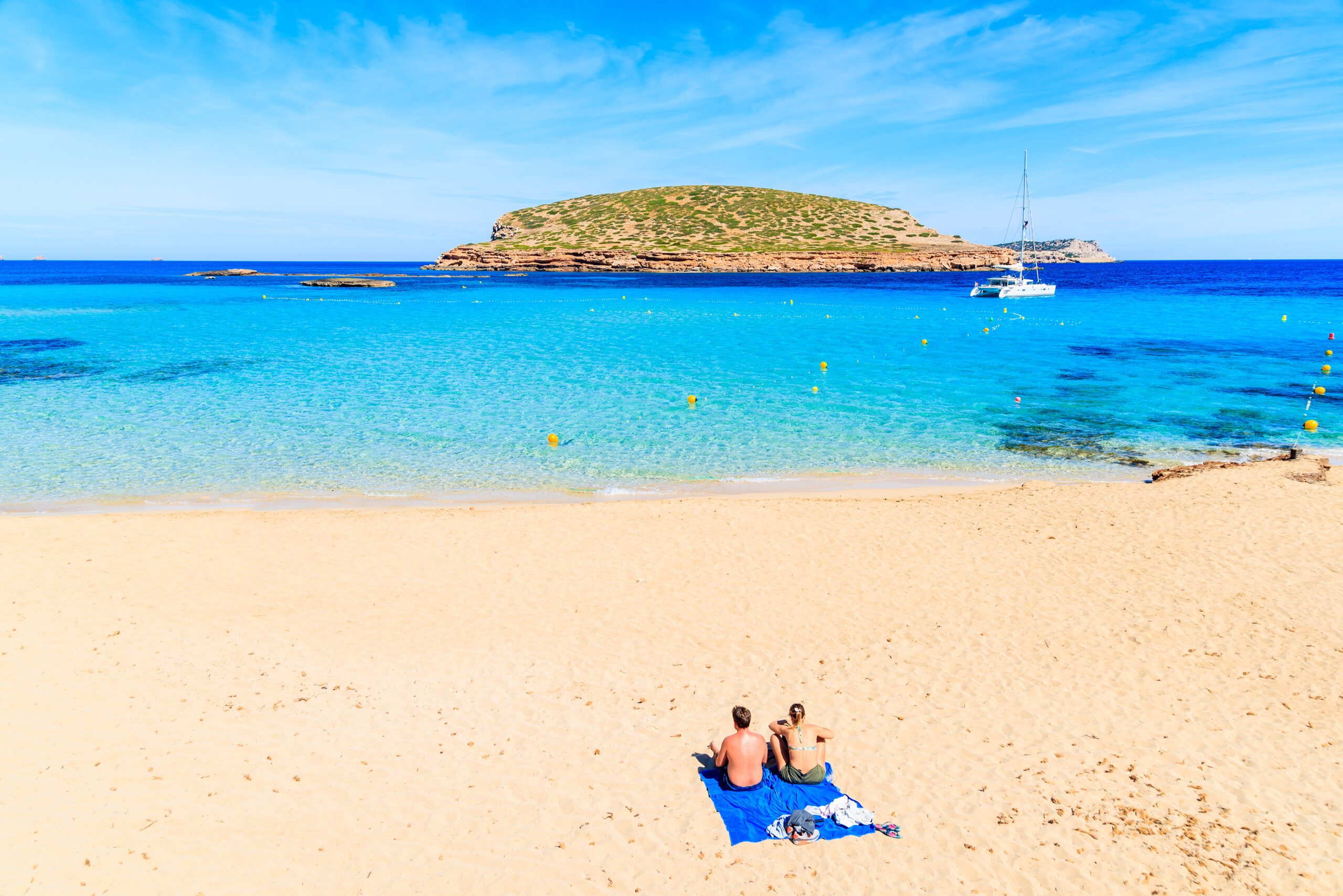 Unidentified,Young,Couple,Of,People,Sunbathing,On,Beautiful,Sandy,Cala ...